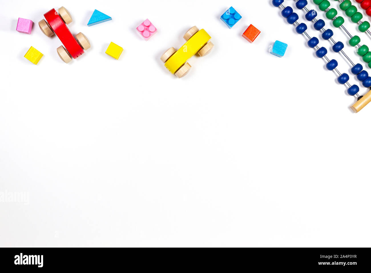 Baby kids toys frame with toy abacus, wooden cars and bricks on white ...