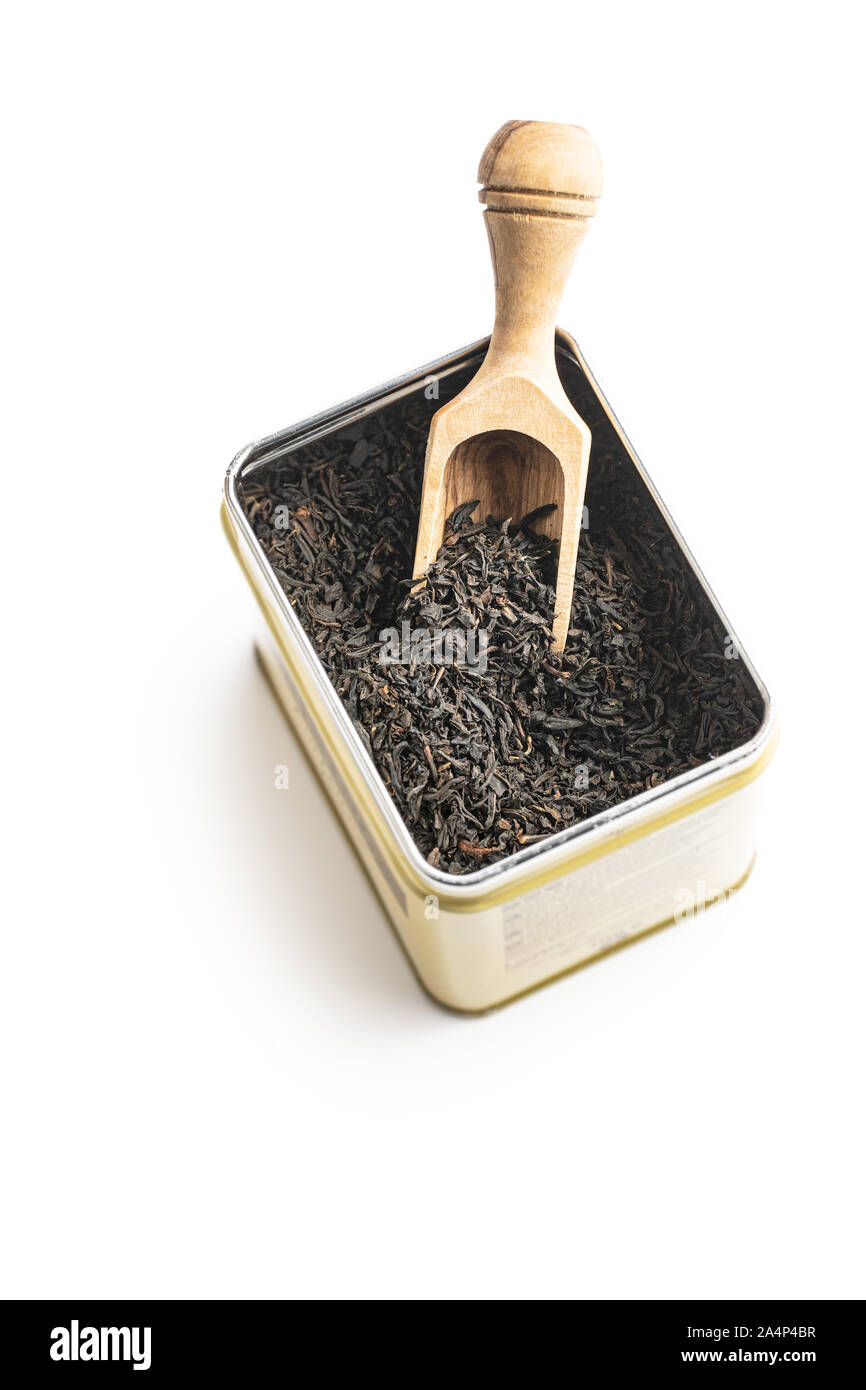 Dried black tea leaves in metal box isolated on white background Stock ...