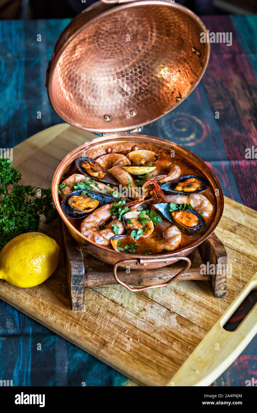 Traditional Portuguese ameijoas with clams served in a cataplana pot on ...