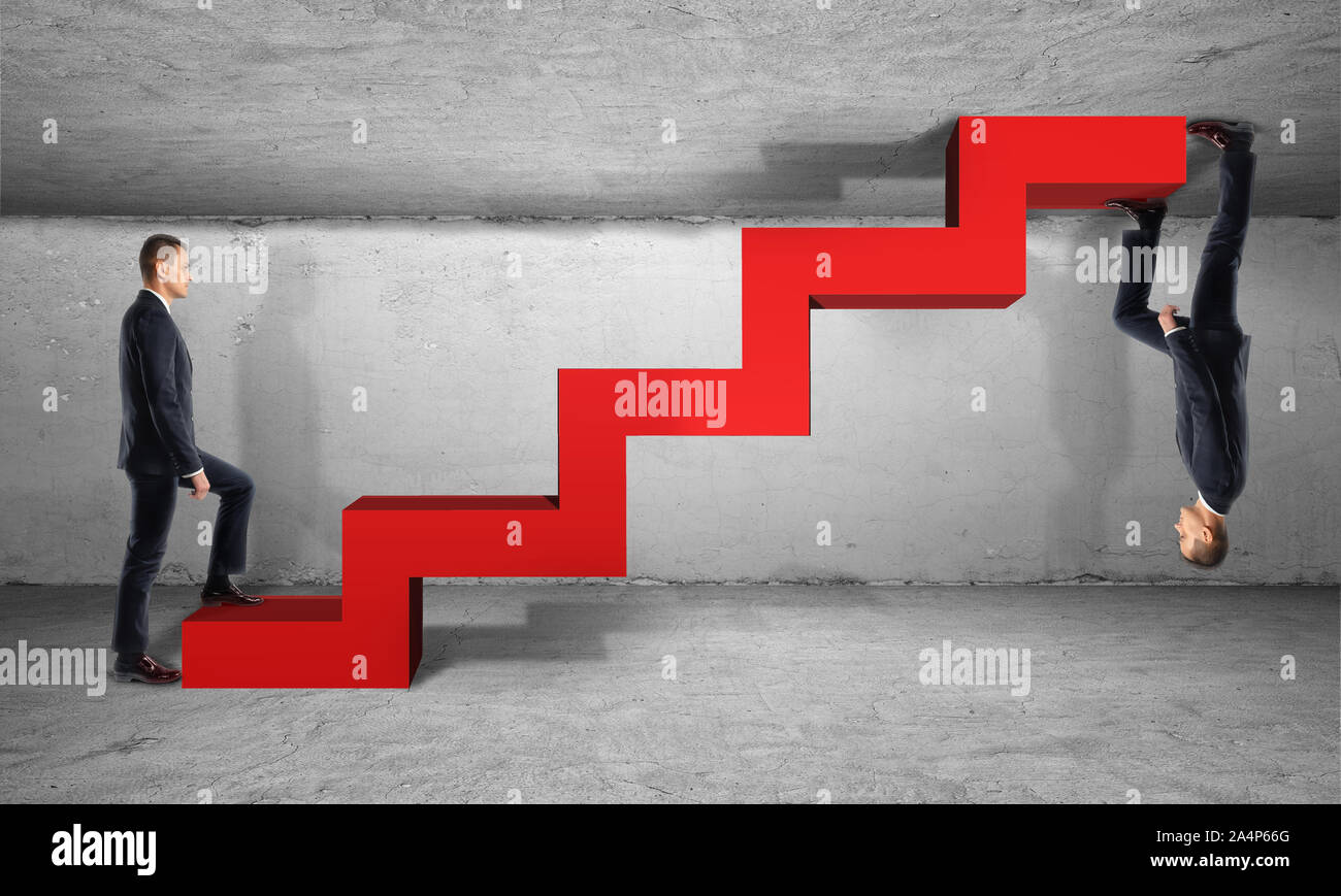 Two businessman climb one red ladder from different sides Stock Photo ...
