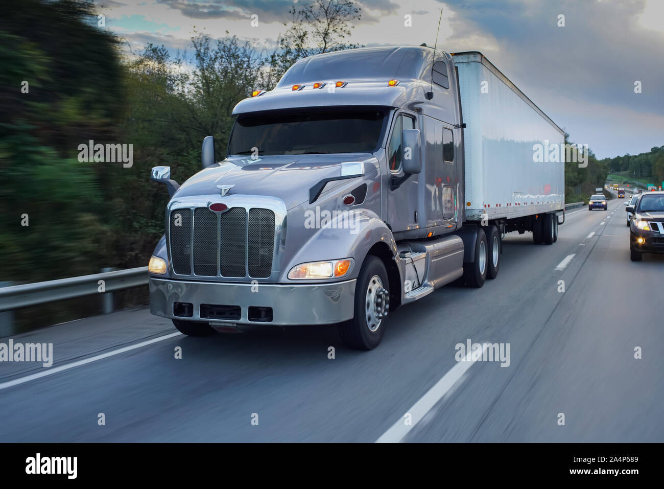 18 wheeler semi truck on the highway road Stock Photo - Alamy