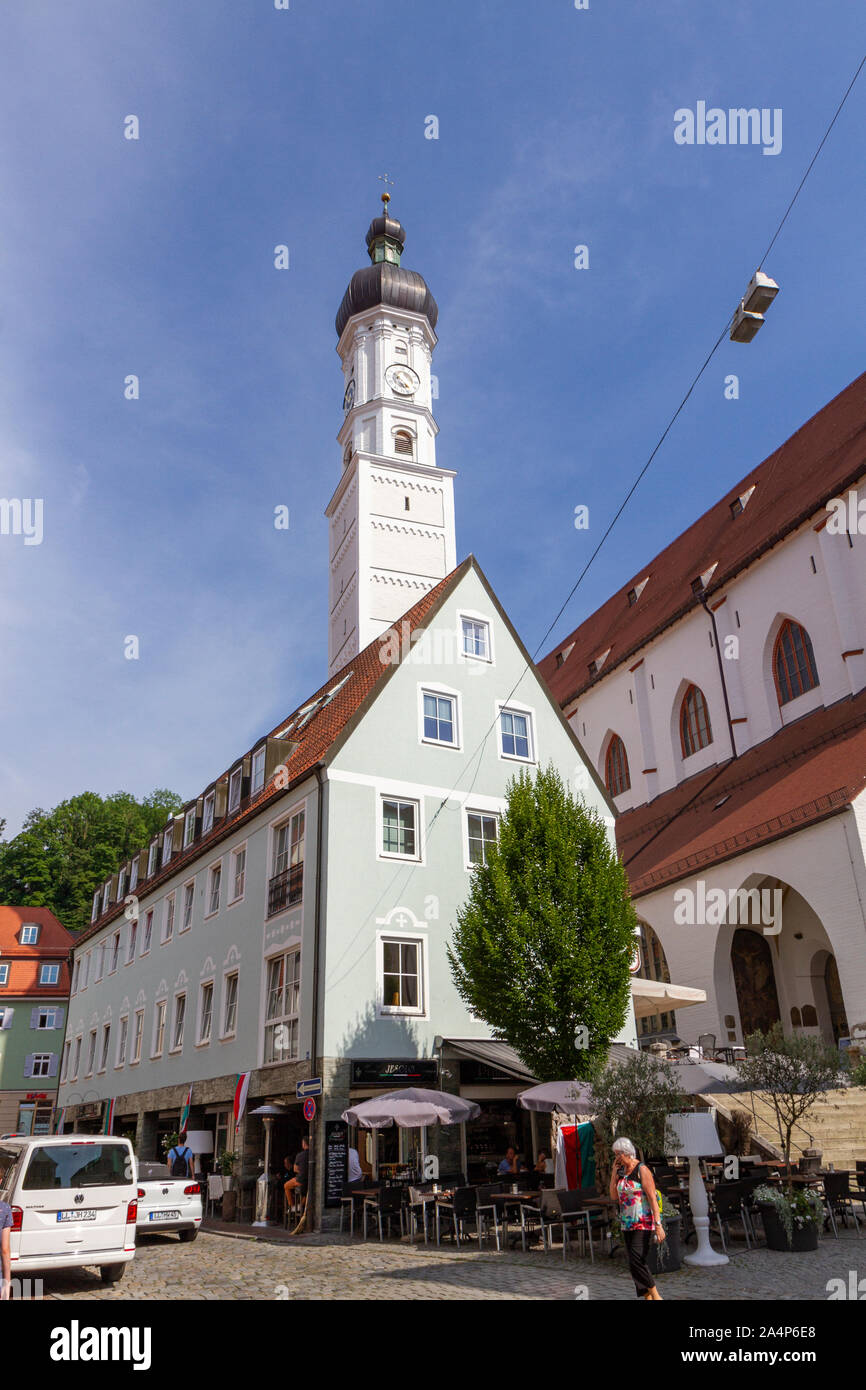 The spire of Church of the Assumption of Mary over the colourful ...