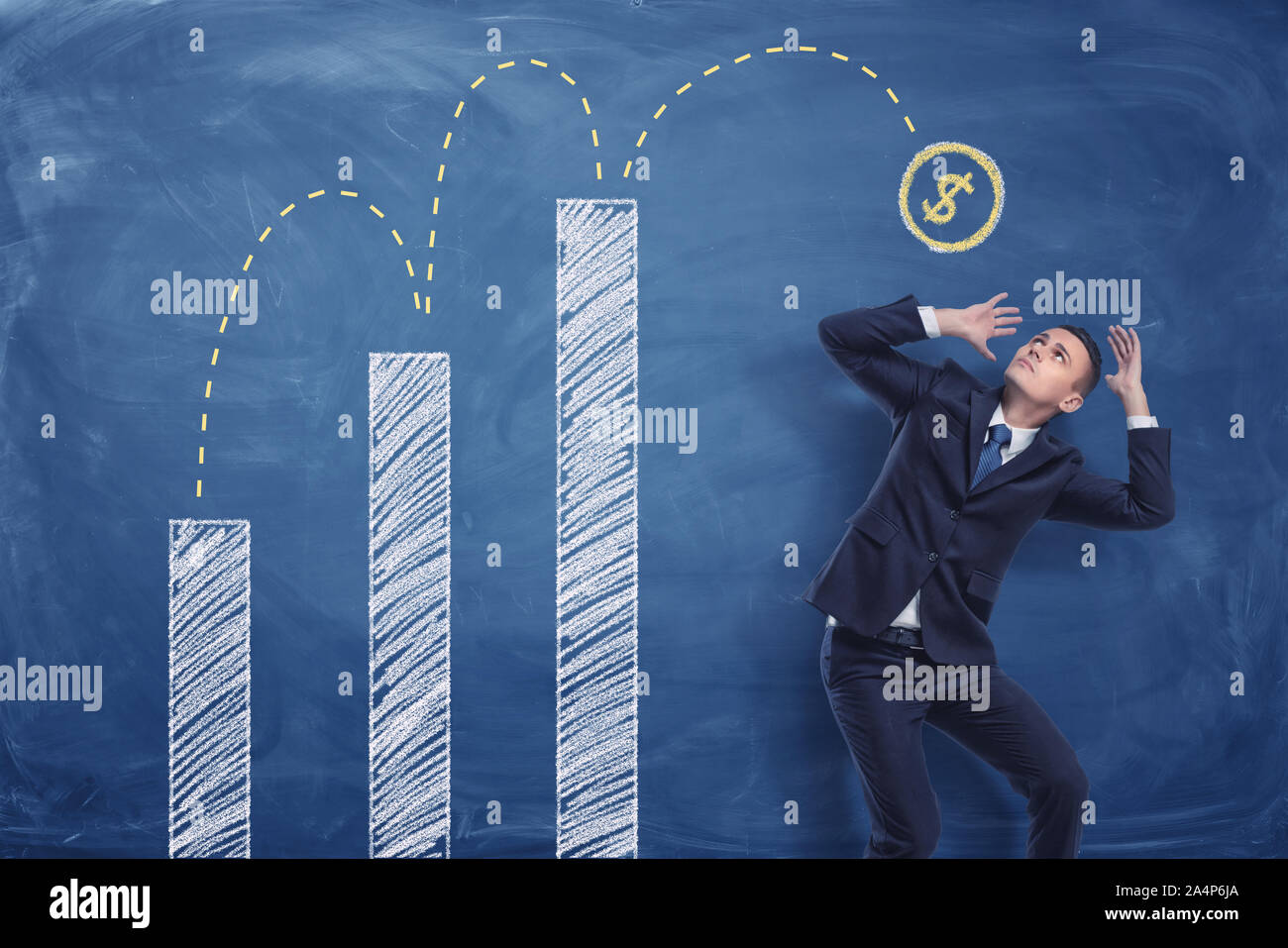 Businessman cowering on blue blackboard background with chalk drawing ...