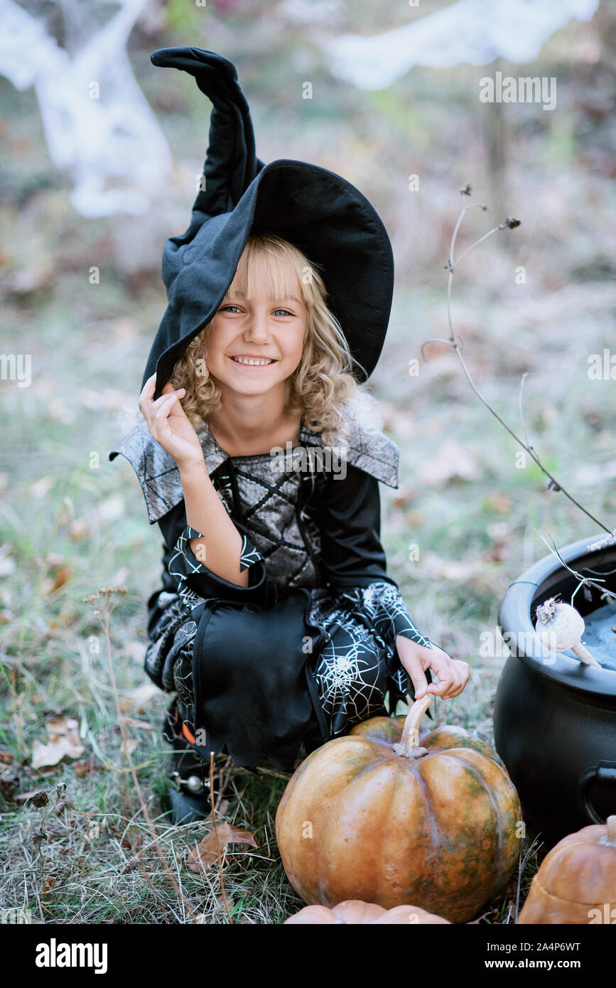 Beautiful girl witch. little girl in which costume celebrate Halloween ...