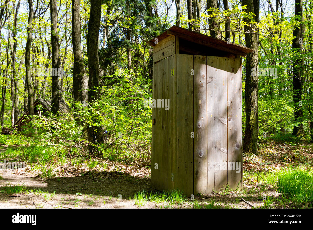 Public wooden outhouse in forest next to archeological site Stock Photo ...