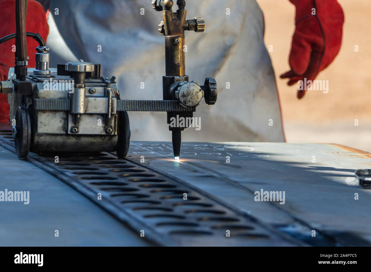 Motswana welder worker in a Botswana workshop, using an acetylene torch ...