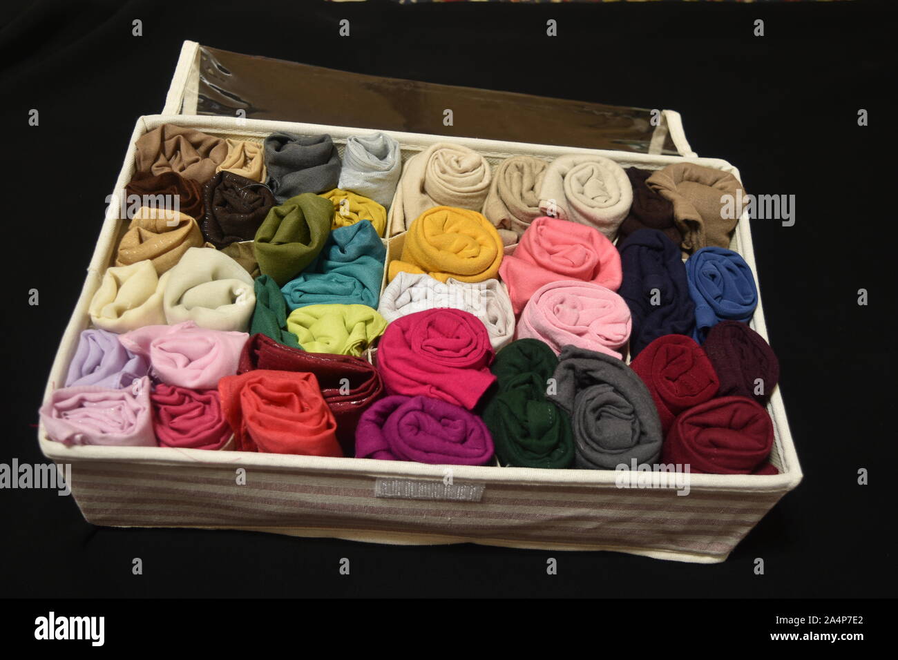 Order clothing by clothes organizer Stock Photo - Alamy