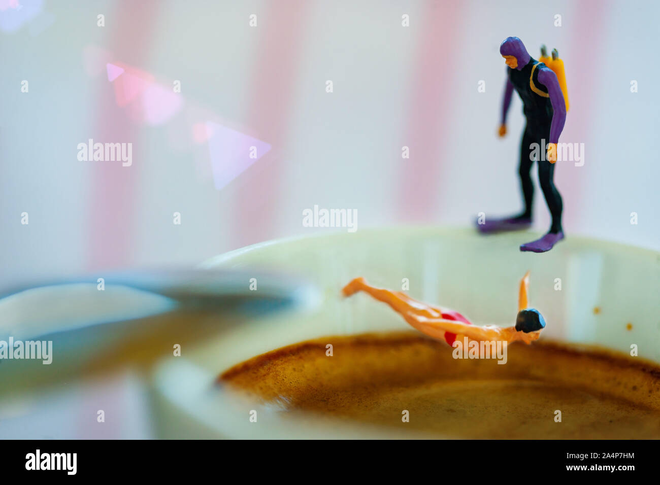 diver and swimmer diving into an esspreso cup Stock Photo - Alamy