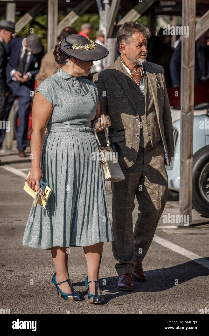 Smartly dressed couple in the paddock area at the 2019 Goodwood Revival ...