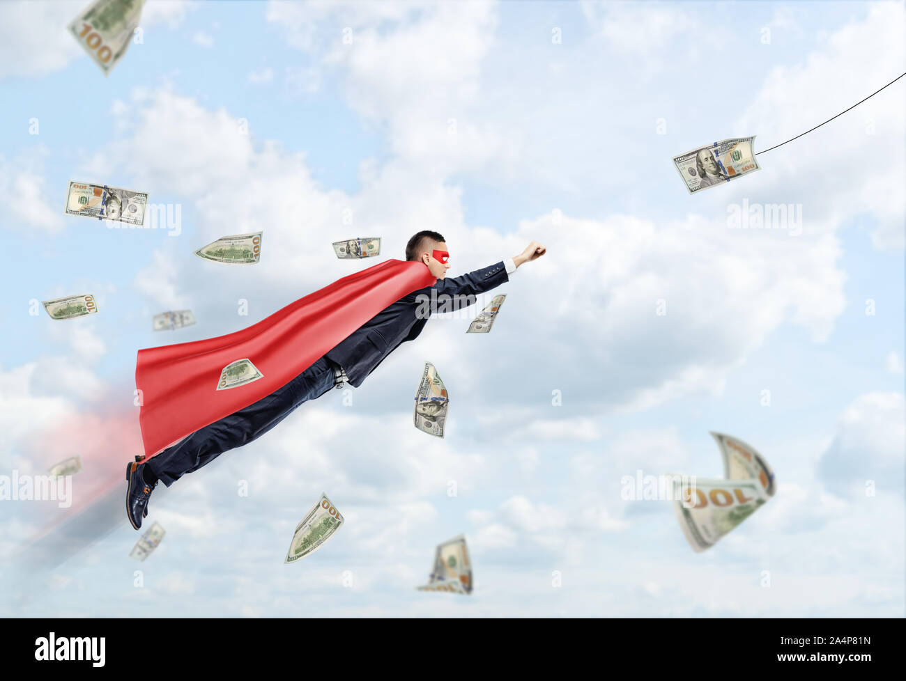 A businessman wearing a red superhero cape flying through the clouds ...