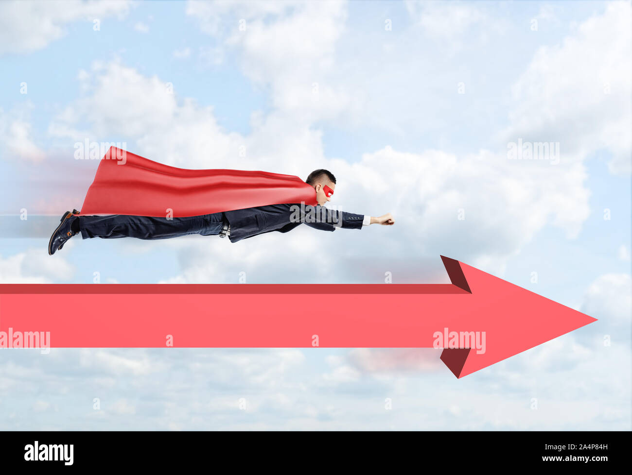 A businessman in a superhero cape flying straight through the clouds ...