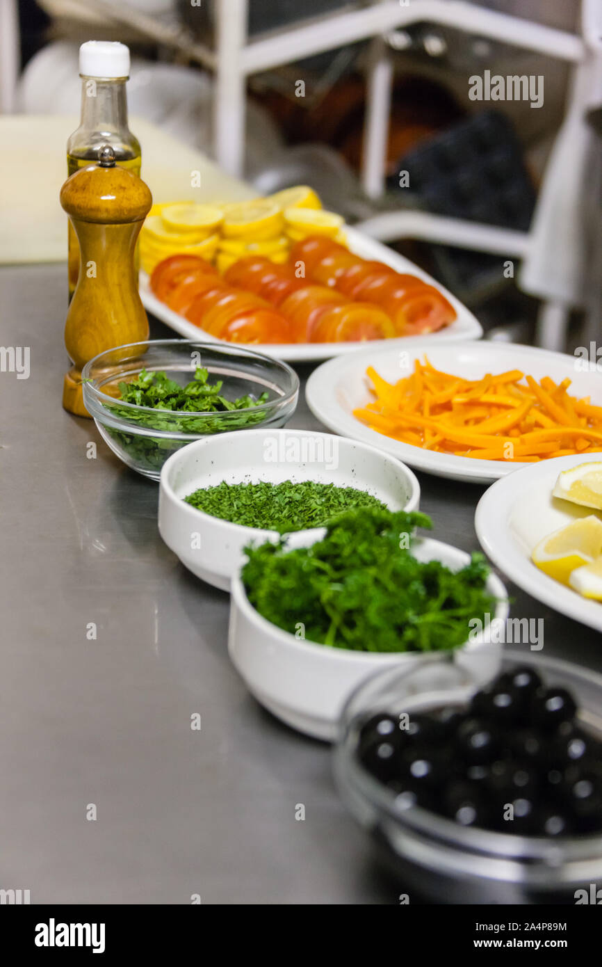 Healthy ingredients on a restaurant kitchen table, ready to go for the ...