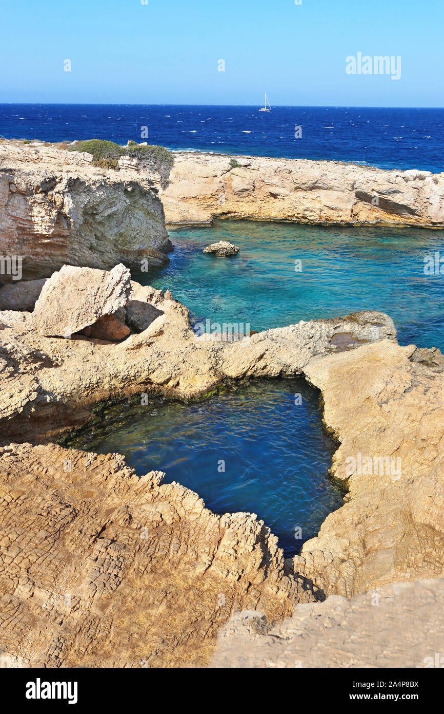 landscape of natural pool of the sea between the rocks at Ano Koufonisi ...