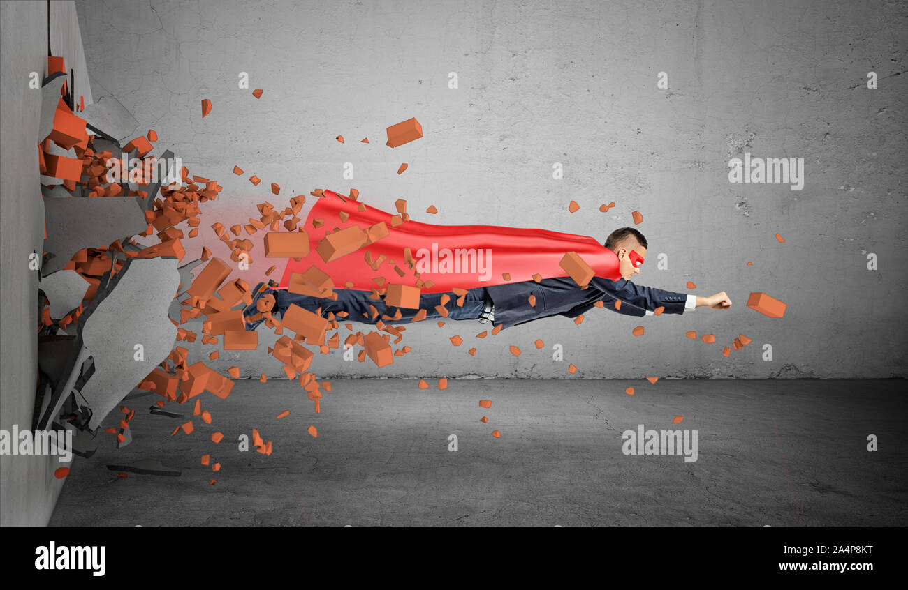 A superhero businessman in a cape flying right through the wall leaving ...