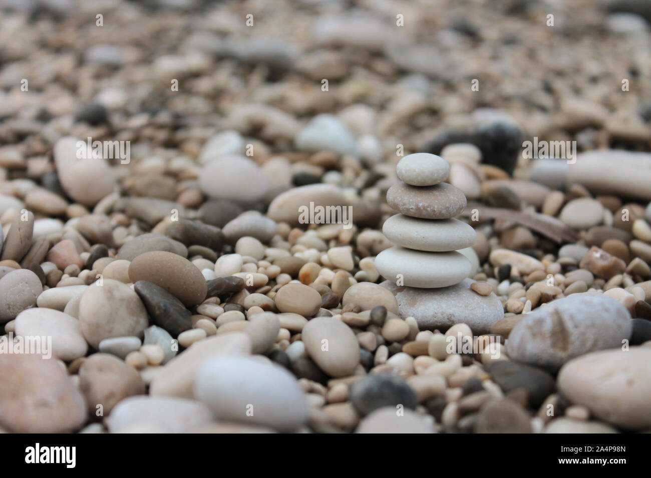 Small cairn on a beach Stock Photo - Alamy