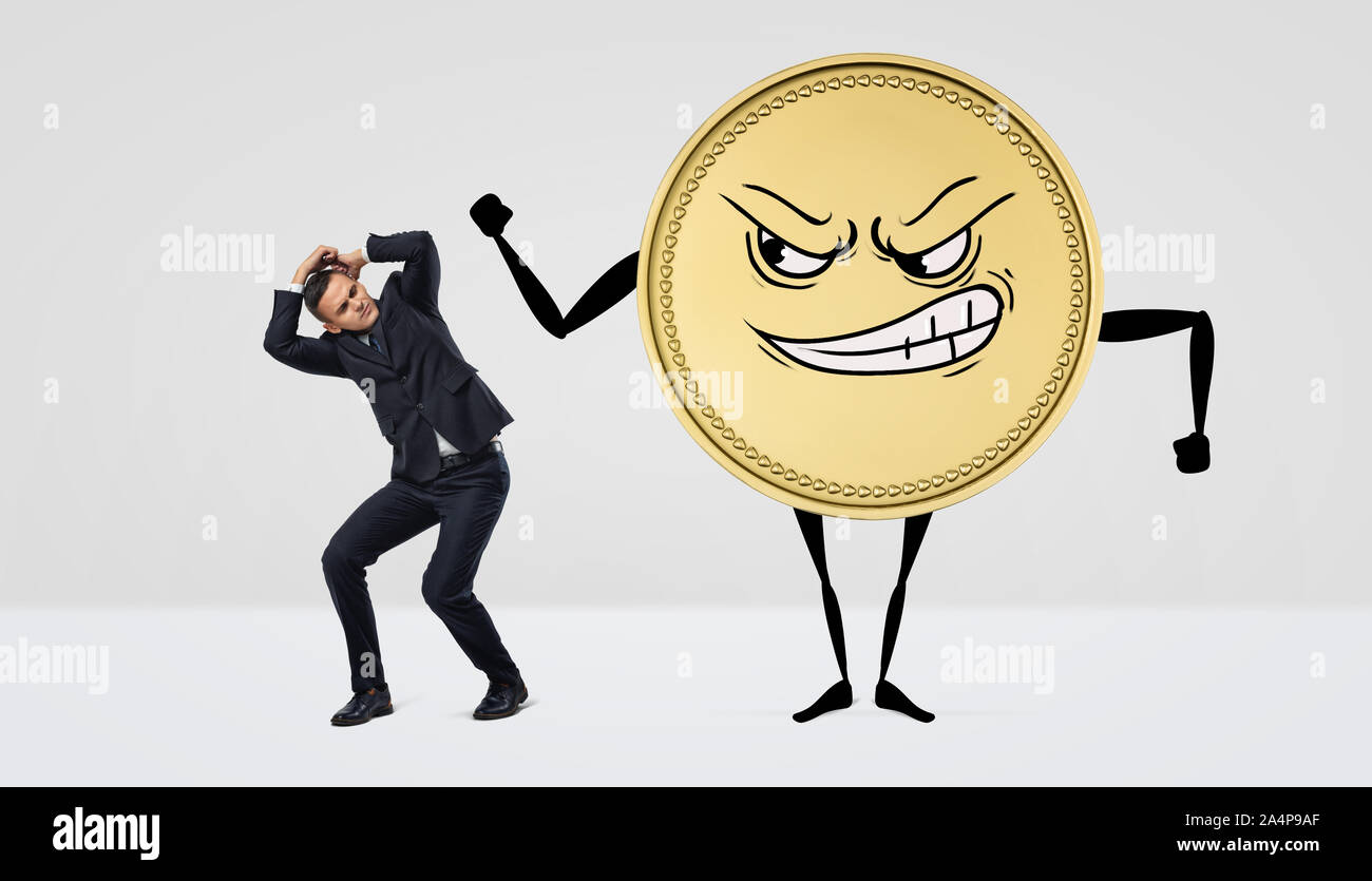 A giant humanoid coin with an angry face beating at a small businessman ...