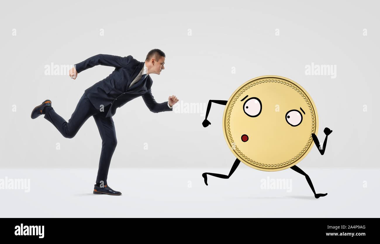 A businessman running after a golden coin with arms and legs on white ...