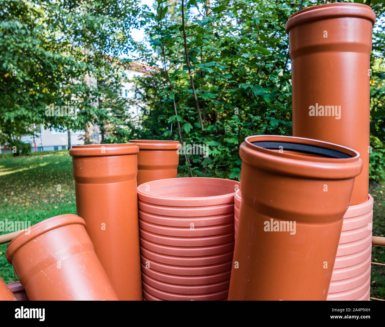 canal pipes on a construction site background Stock Photo - Alamy
