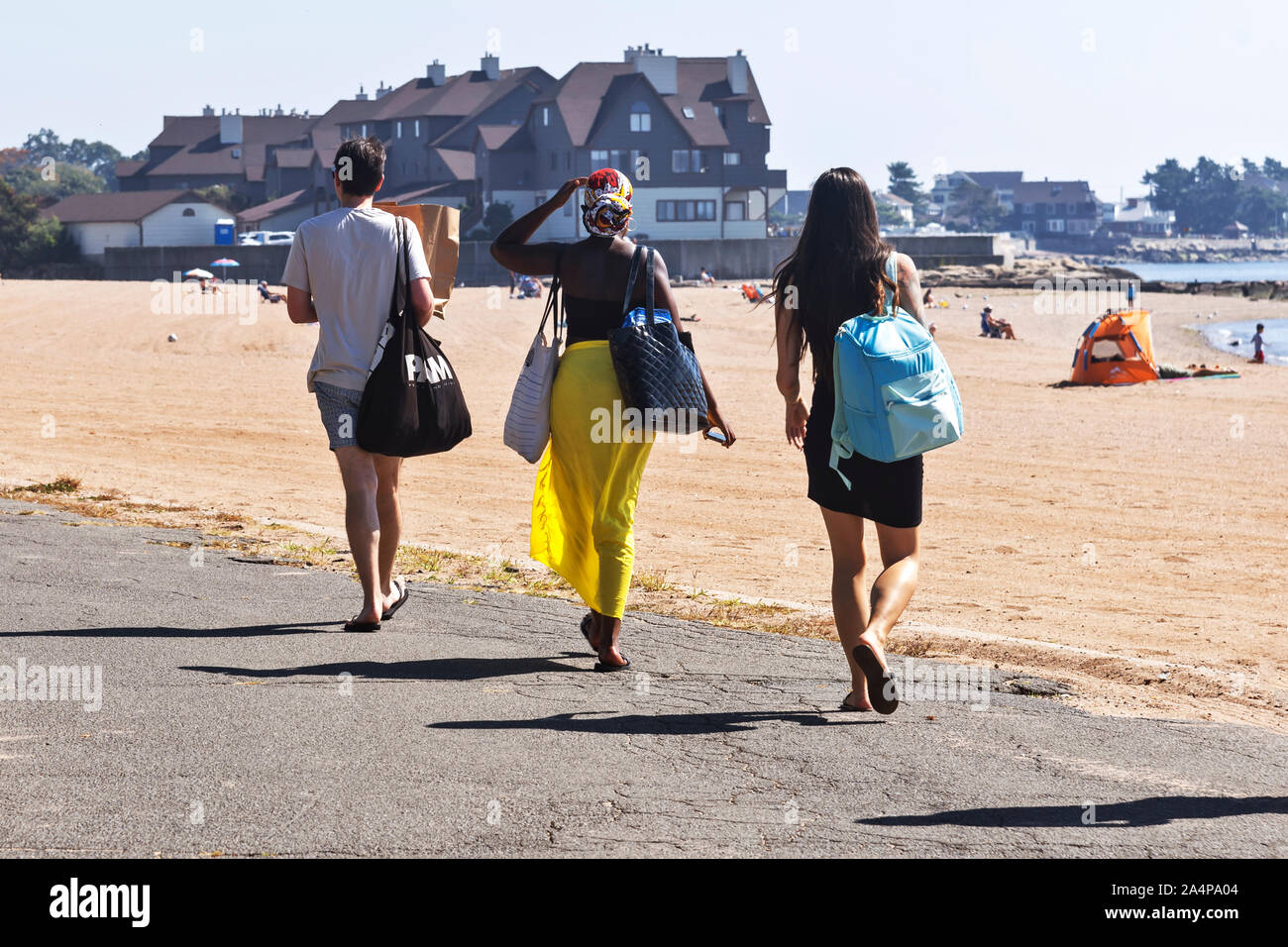 Three young people come to the beach, Lighthouse Point Park , New Haven ...