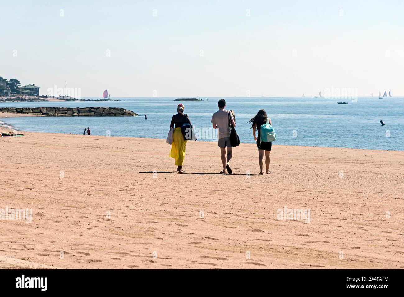 Three young people come to the beach, Lighthouse Point Park , New Haven ...