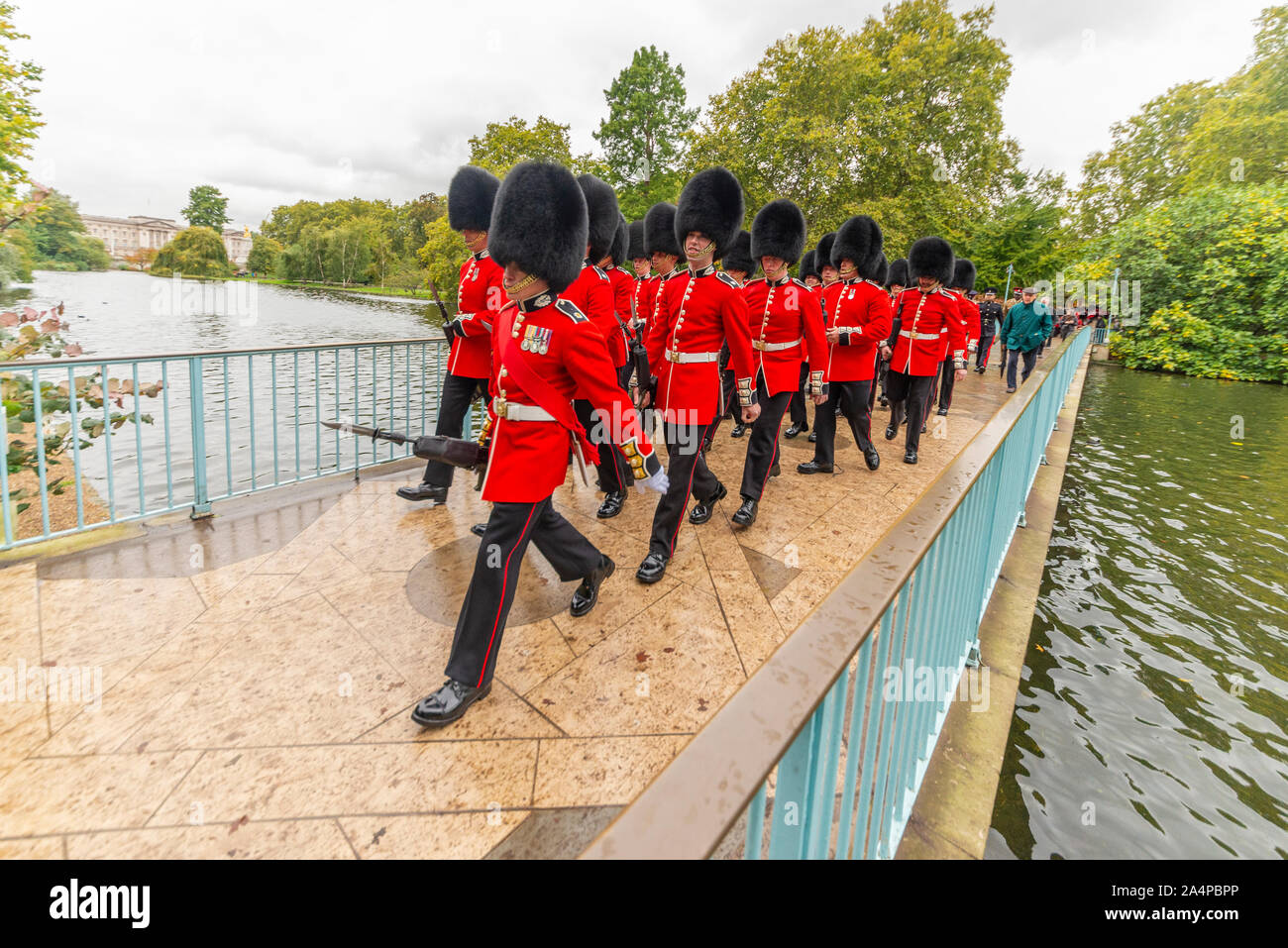 British Army Guards breaking step crossing the Blue Bridge in St James ...