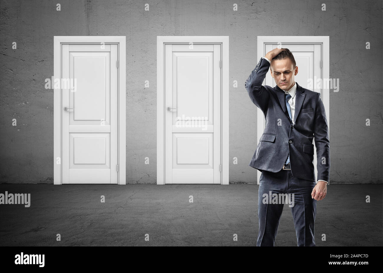 A worried businessman grabs his head with three blank white closed ...