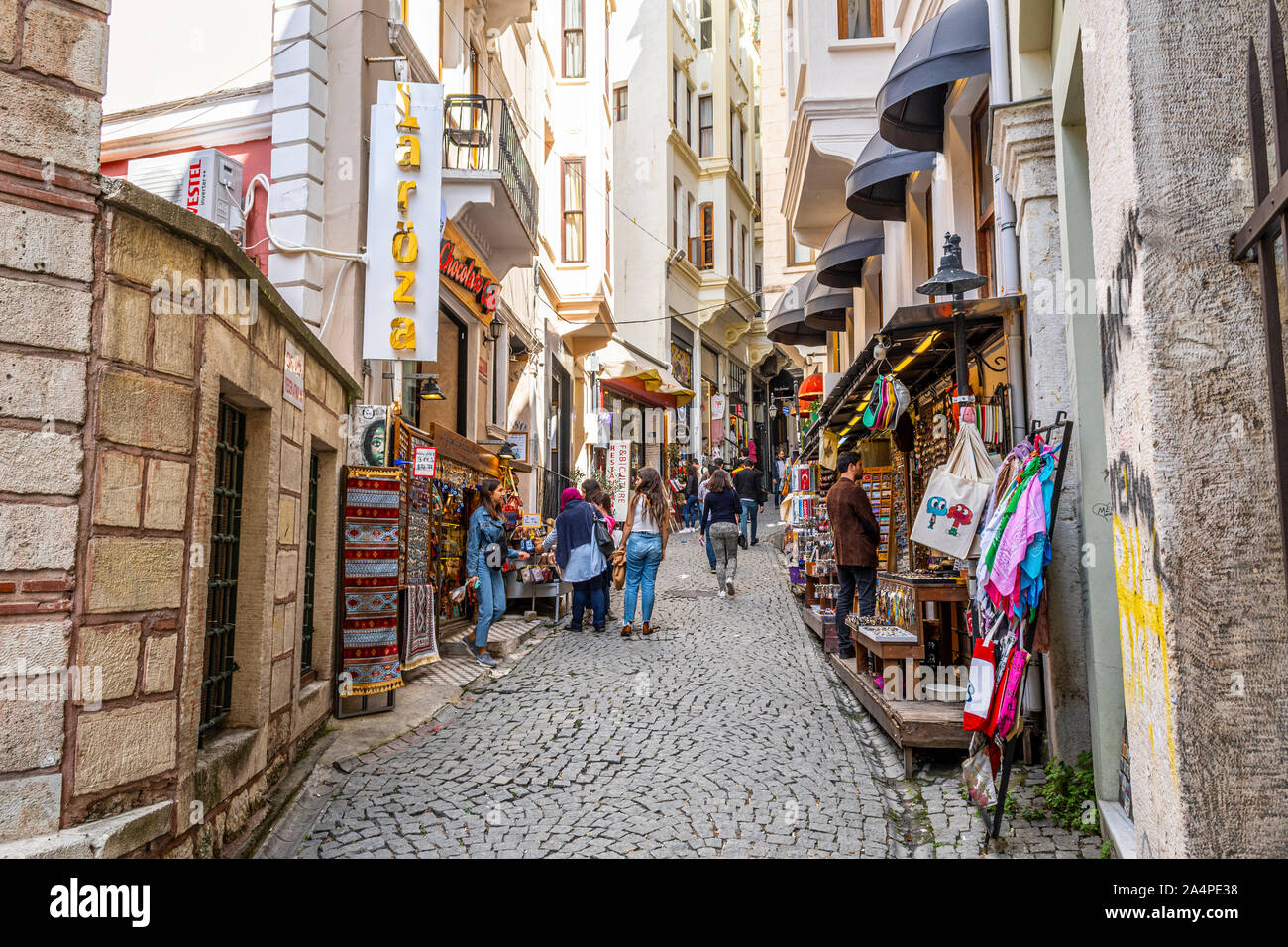 Local Turks including a group of younger girls go shopping on a ...