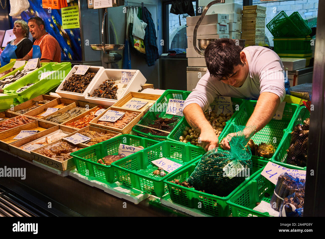 A fishmonger's stall at La Ribera market in the Old town of Bilbao ...