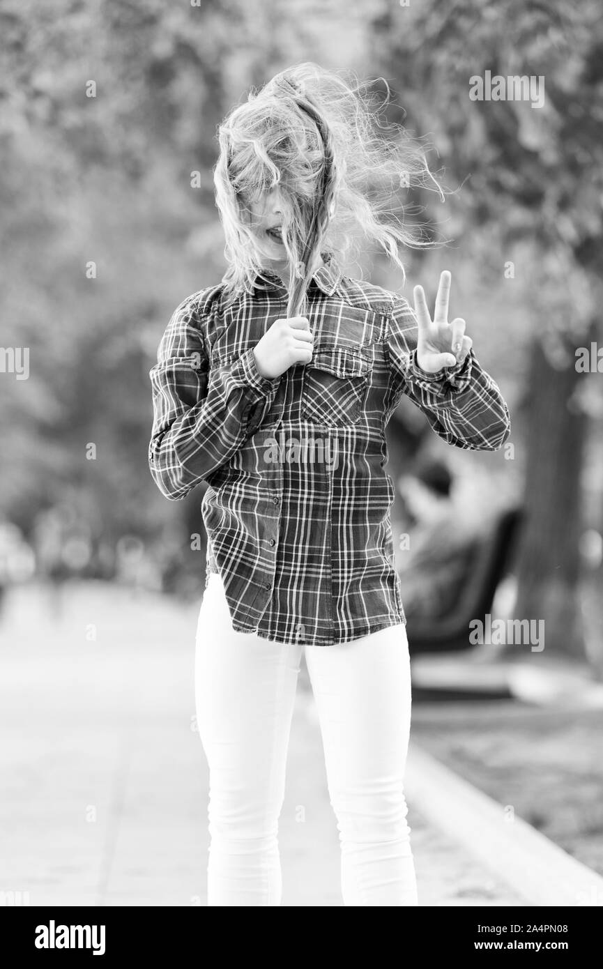 It is windy outside. Little child with messy hair on summer day. Cute ...