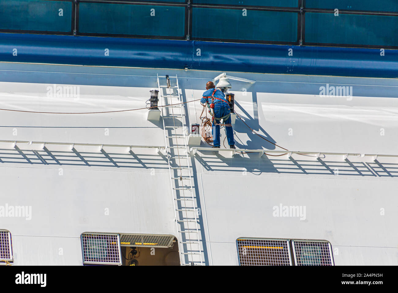 Ship Employee Working on Security Camera Stock Photo - Alamy