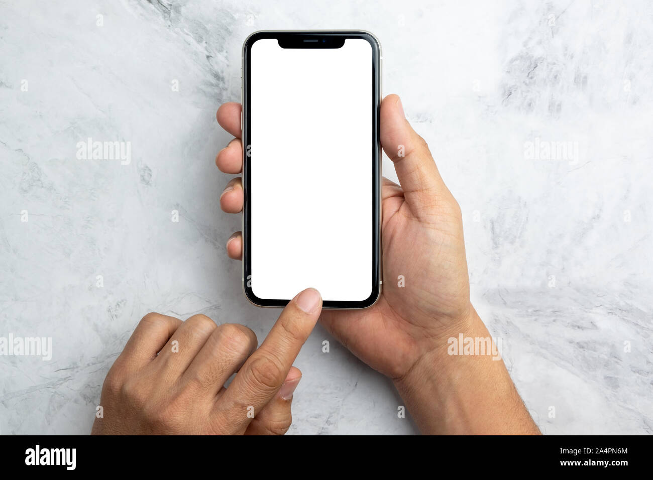 Hand using smart phone white screen on top view Stock Photo - Alamy