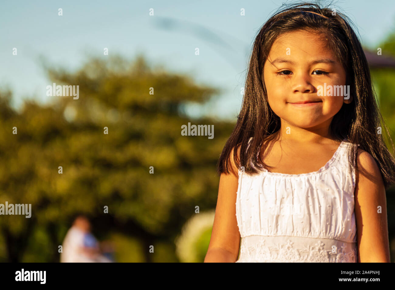 Cute Mexican American children are playing and enjoying bubbles in a ...