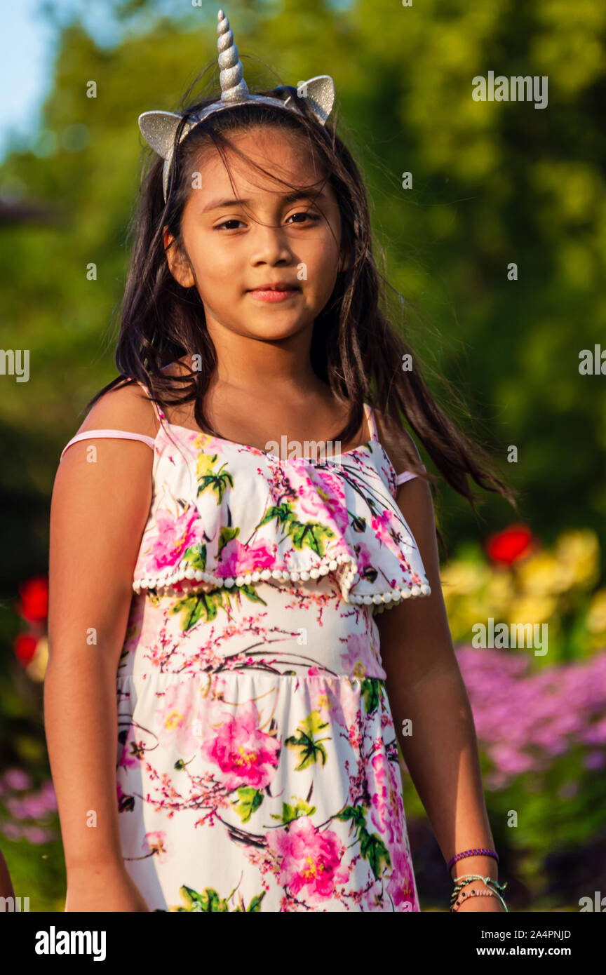 Cute Mexican American children are playing and enjoying bubbles in a ...