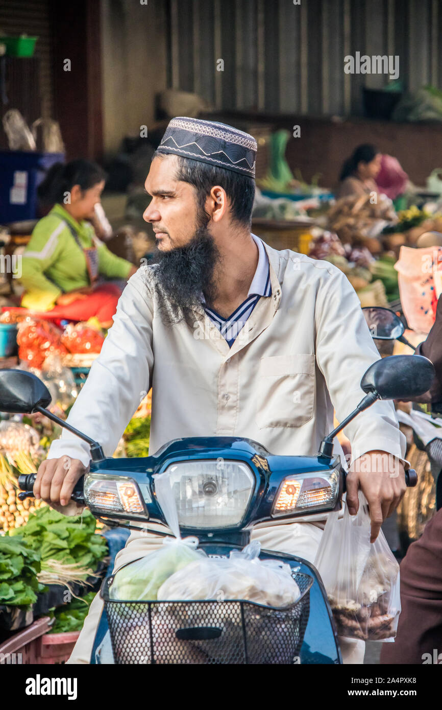 Mae Sot, Thailand - February 3rd 2019: Muslim man on motorbike ...