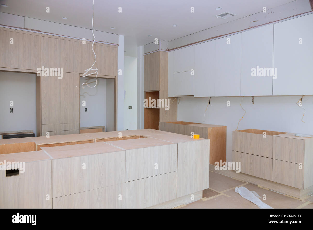 Custom kitchen cabinets in various stages of installation base for ...