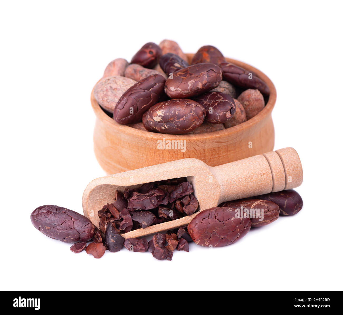 Peeled cocoa beans in the wooden bowl, isolated on white background ...
