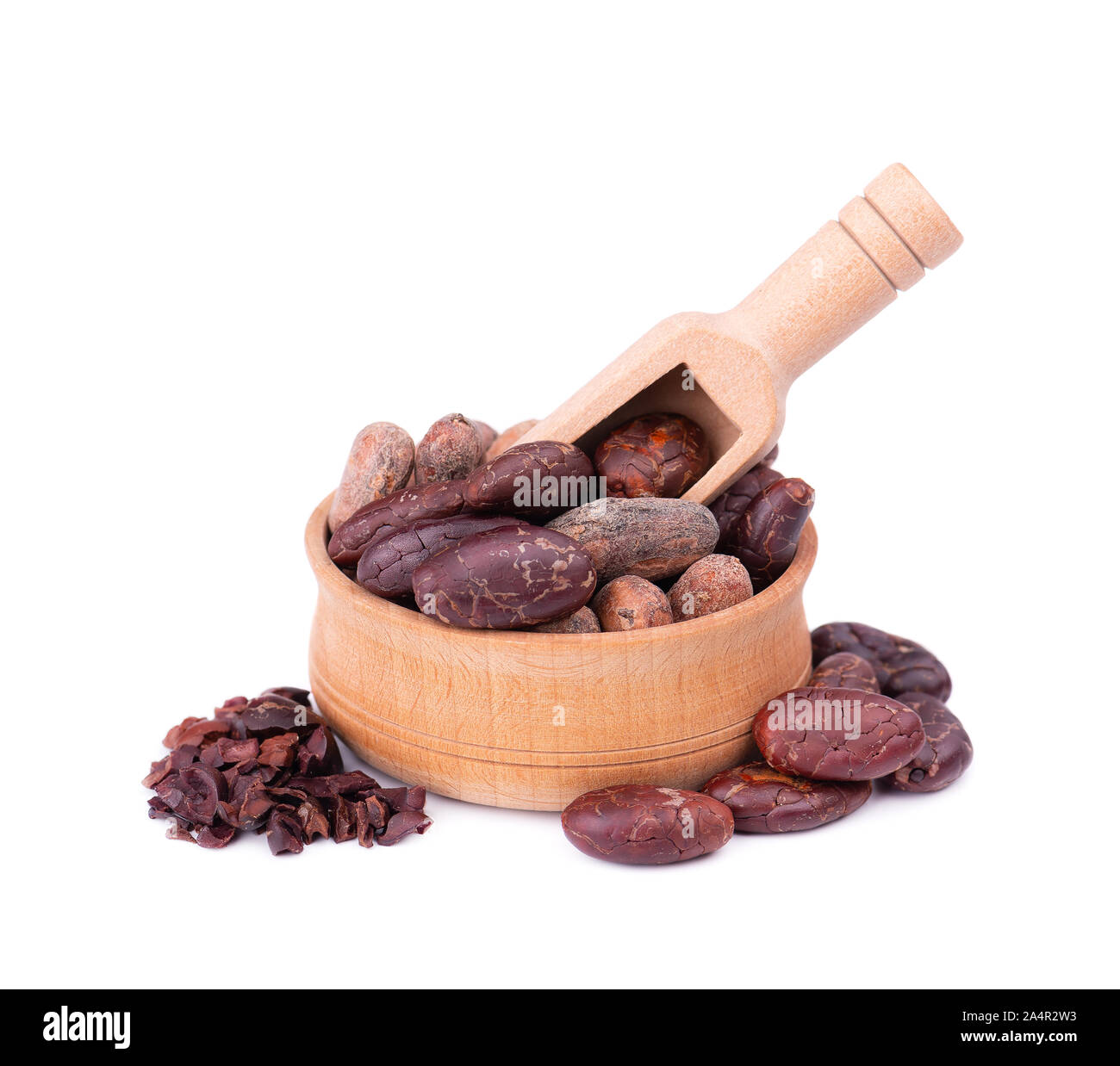 Peeled cocoa beans in the wooden bowl, isolated on white background ...