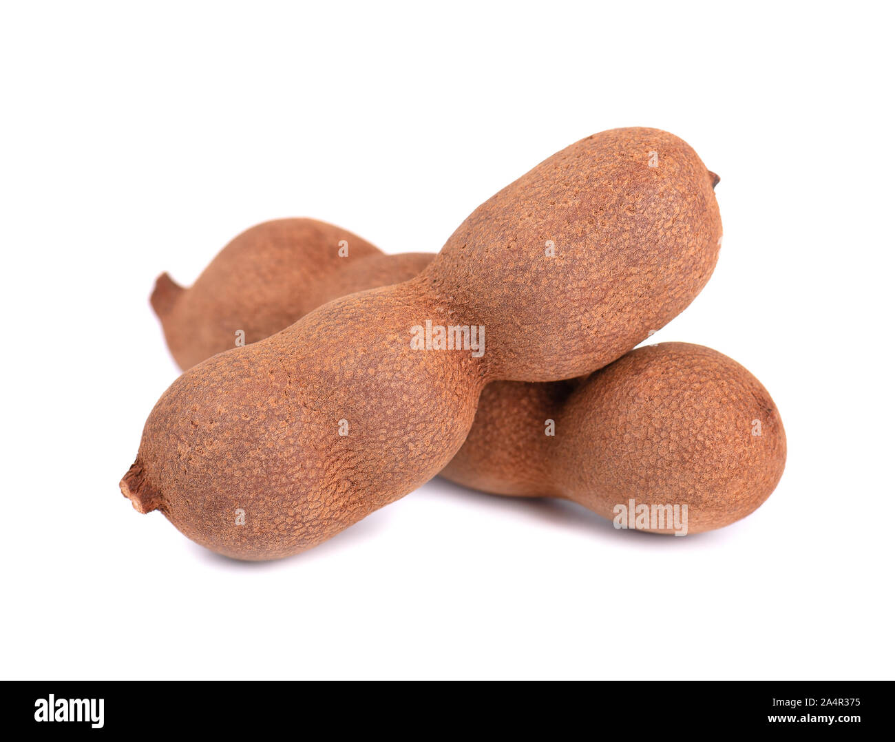 Sweet tamarind isolated on white background. Two fresh whole tamarinds ...
