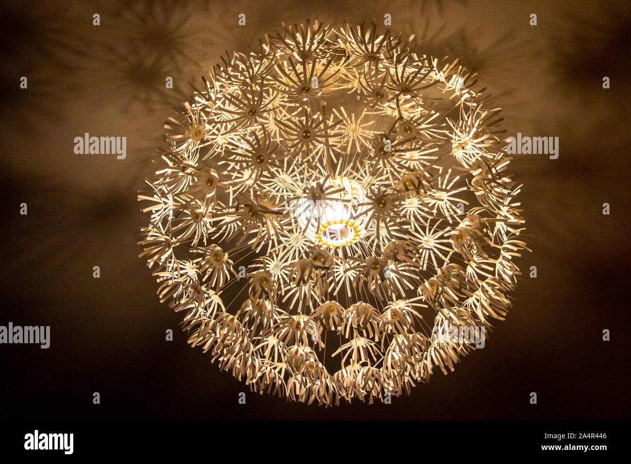 Stylish white ceiling light with beautiful shadows on the ceiling Stock ...