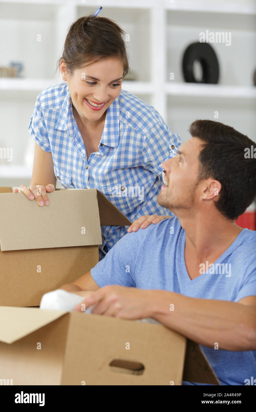 young couple packing boxes for moving to a new home Stock Photo - Alamy