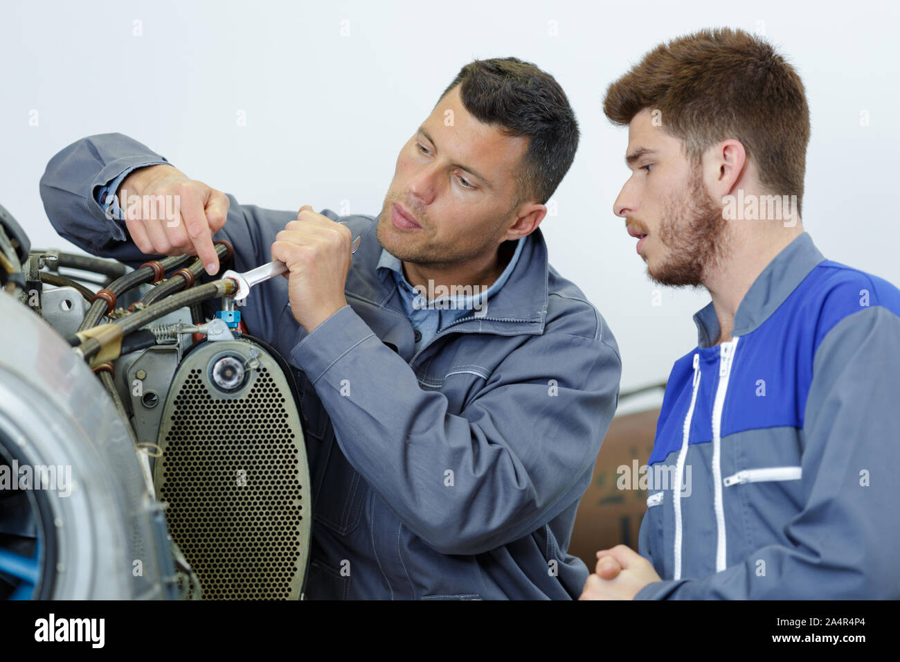 Two mechanics working together hi-res stock photography and images - Alamy