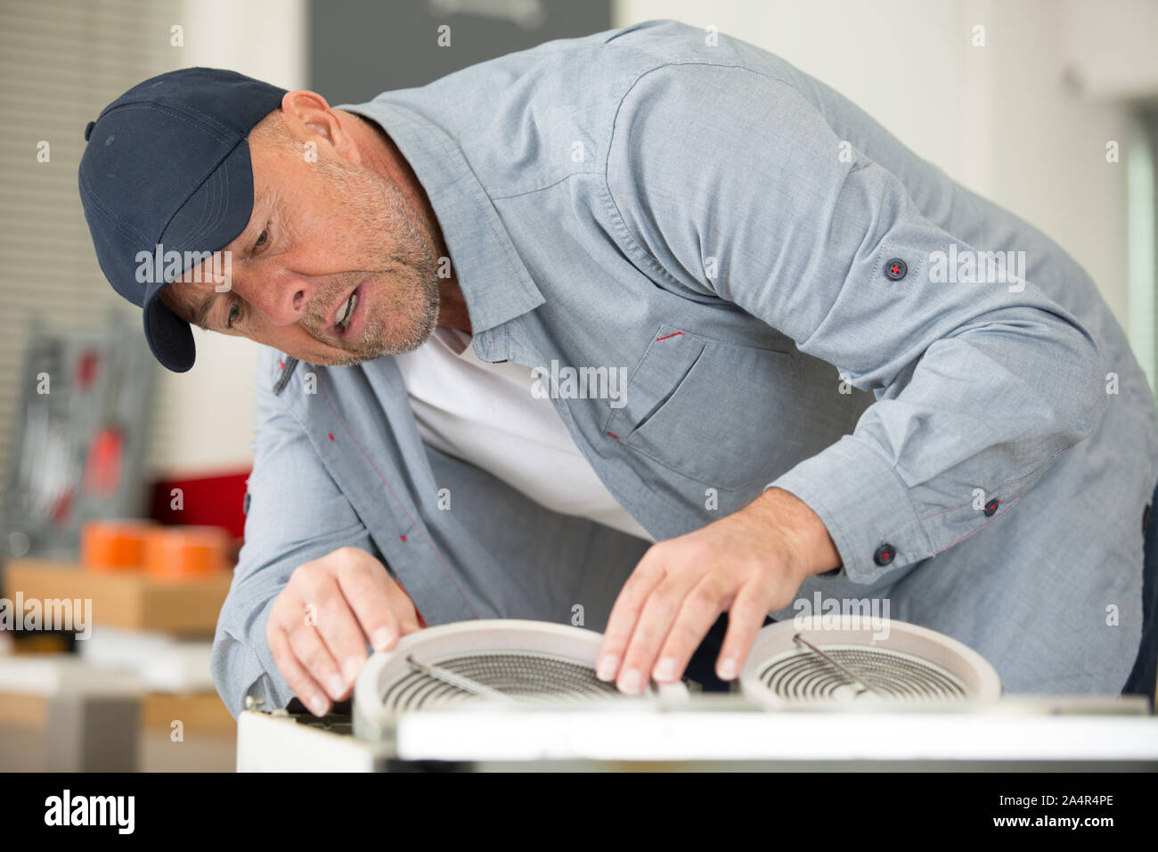 installing new induction hob in modern kitchen Stock Photo - Alamy