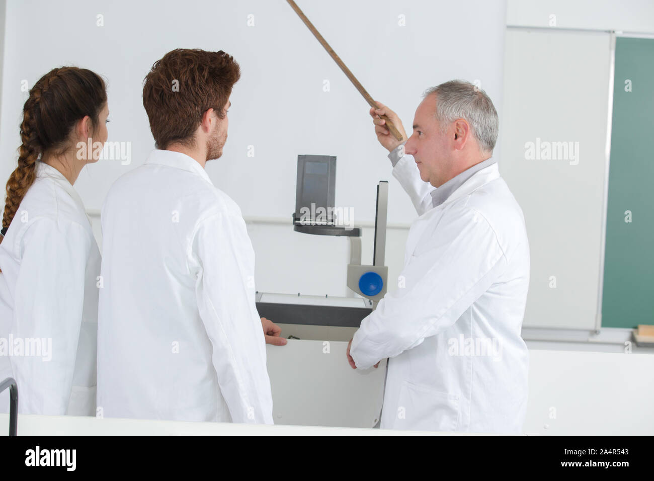 Female physics teacher with experiment hi-res stock photography and ...
