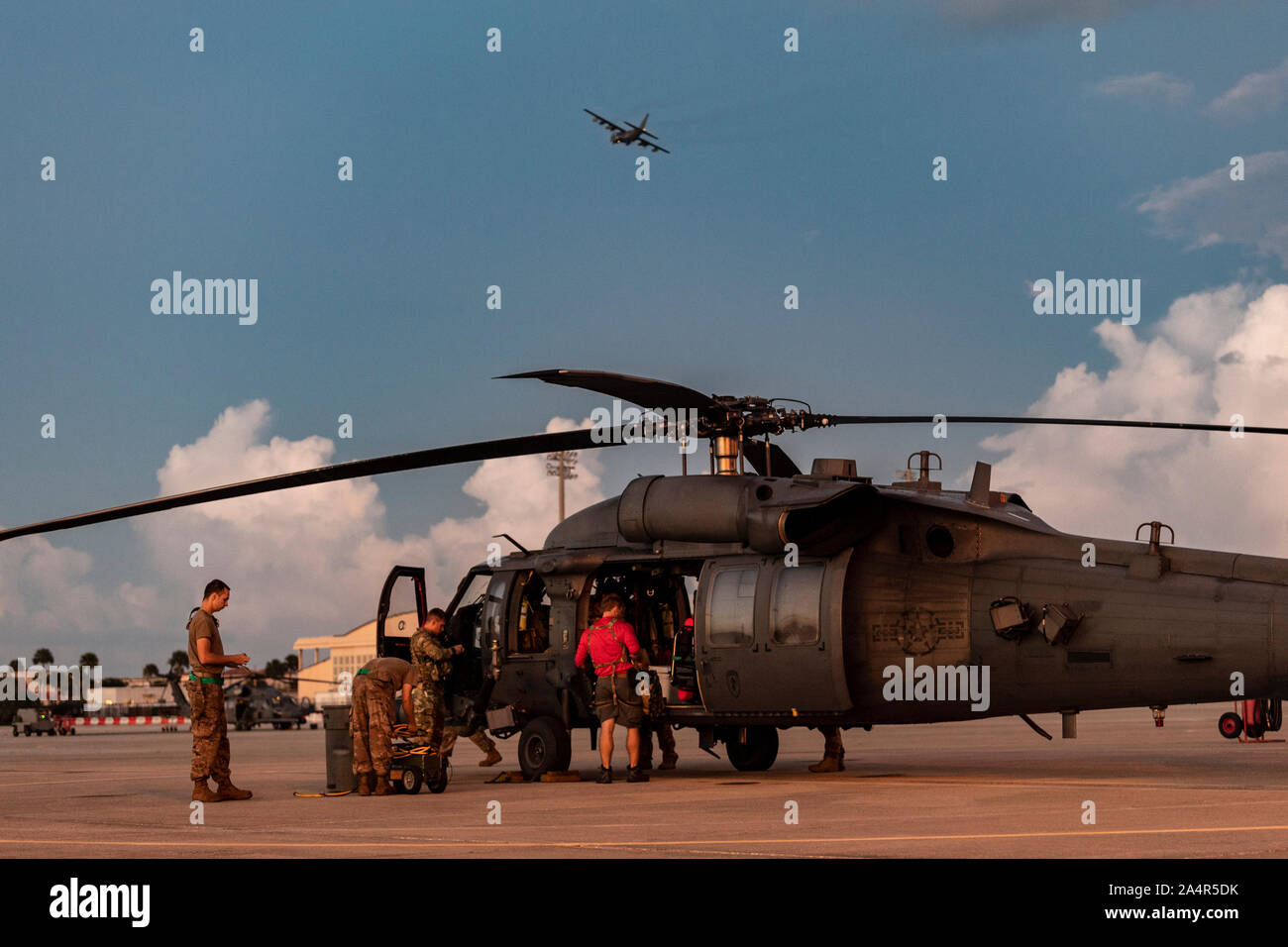 Airmen from the 347th Rescue Group (RQG) prepare for a post-flight ...