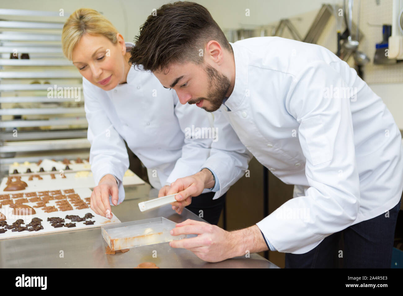 a worker at chocolate factory Stock Photo - Alamy