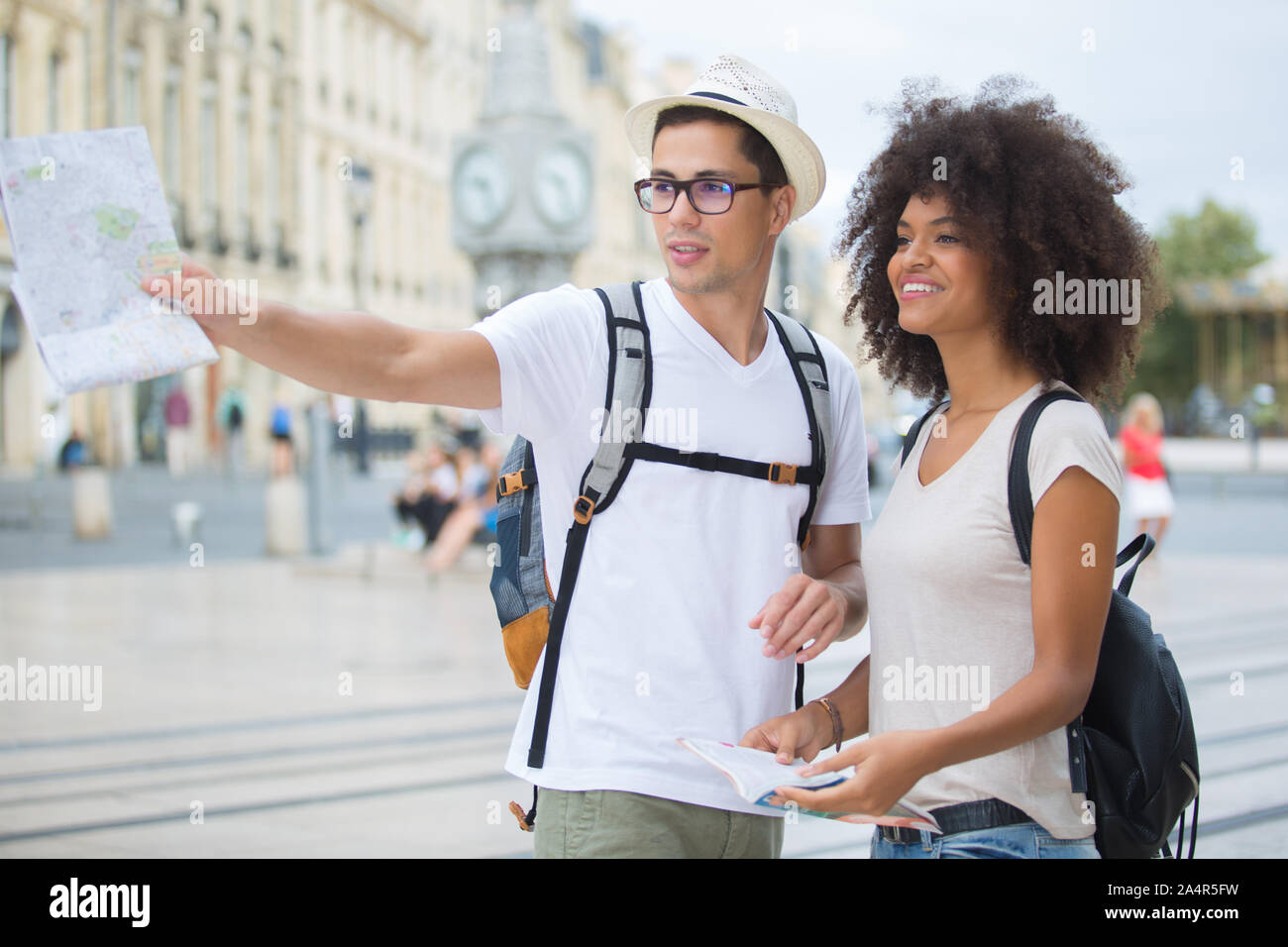 Female guide speaking tourists hi-res stock photography and images - Alamy