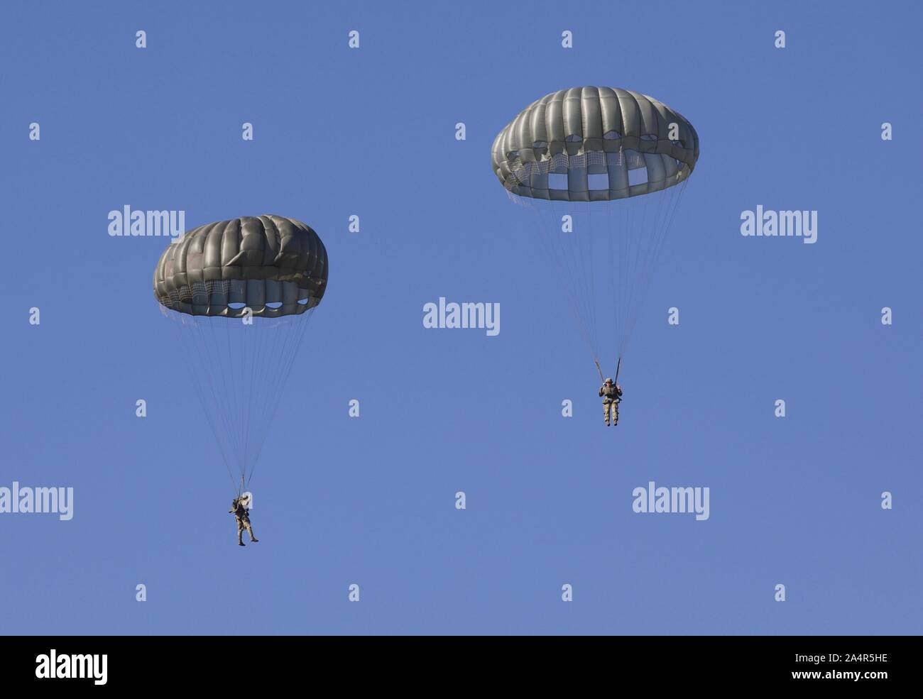 Two U.S. Army Rangers, assigned to the 5th Ranger Training Battalion, descend to the ground ...