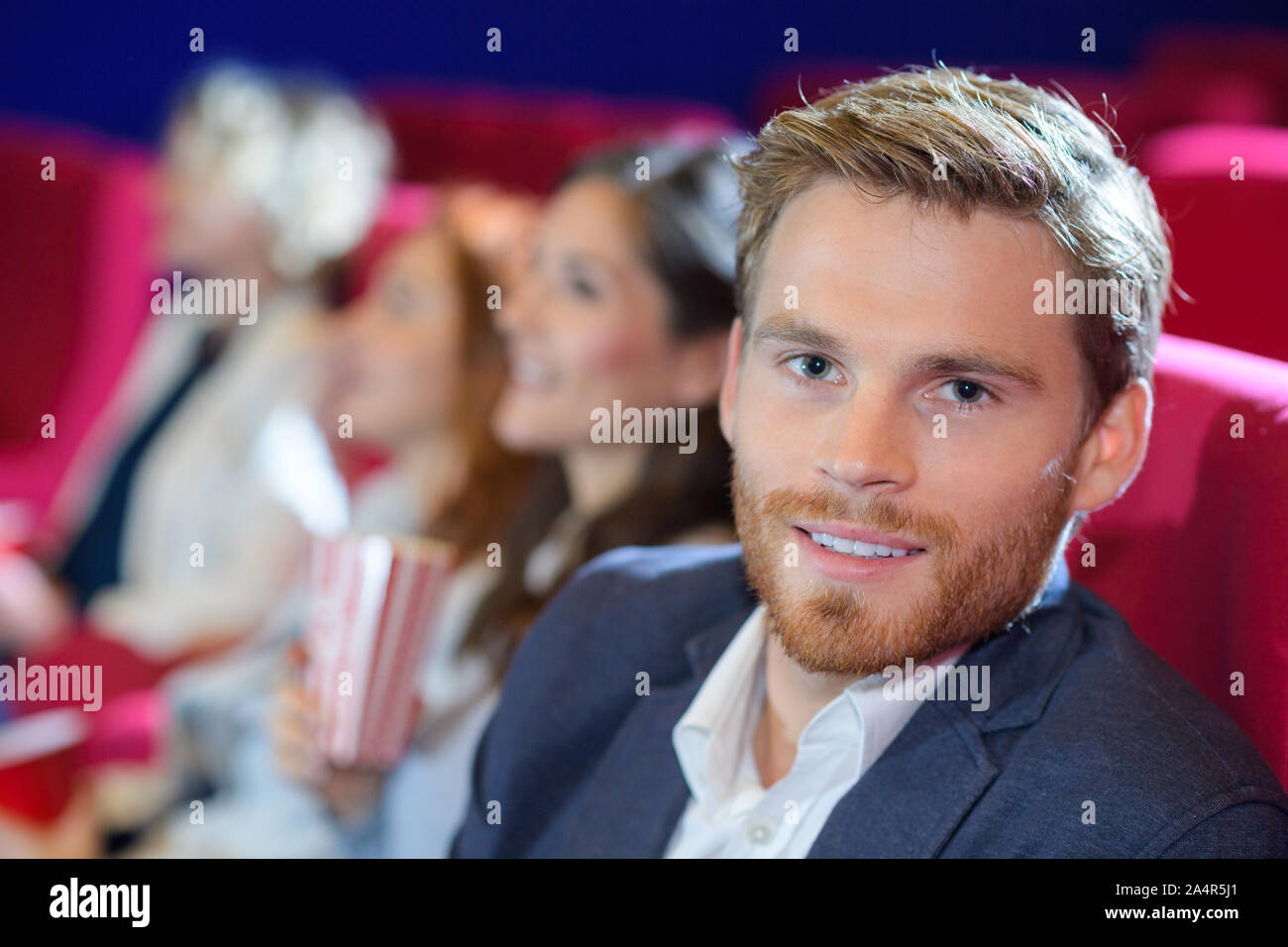 man in the cinema posing Stock Photo - Alamy