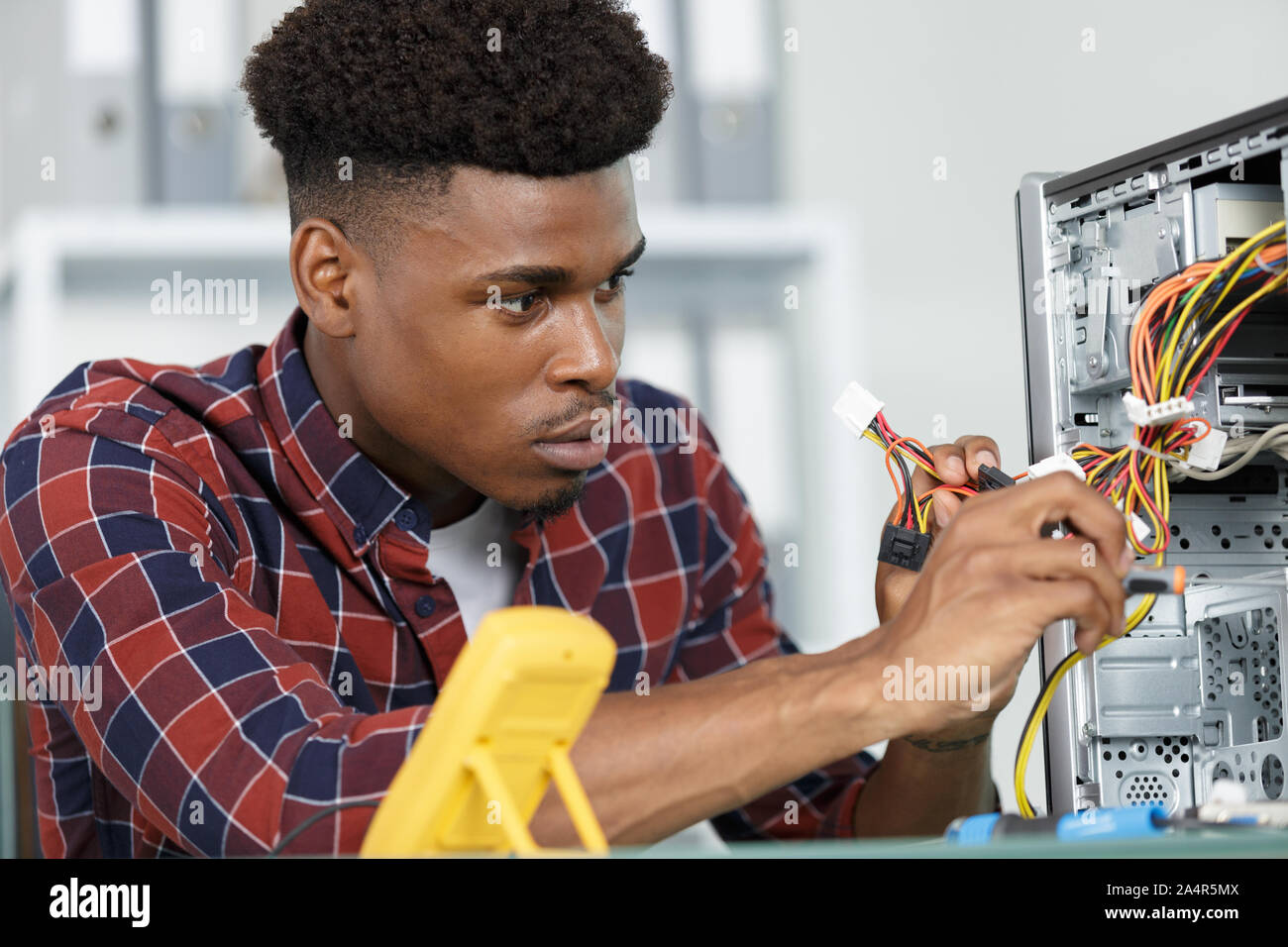 man fixing broken pc Stock Photo - Alamy
