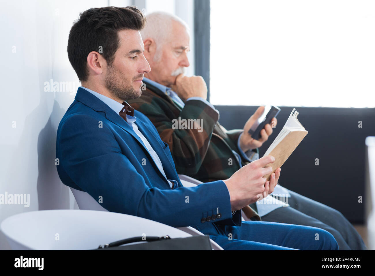 two businessmen waiting for a job interview Stock Photo - Alamy